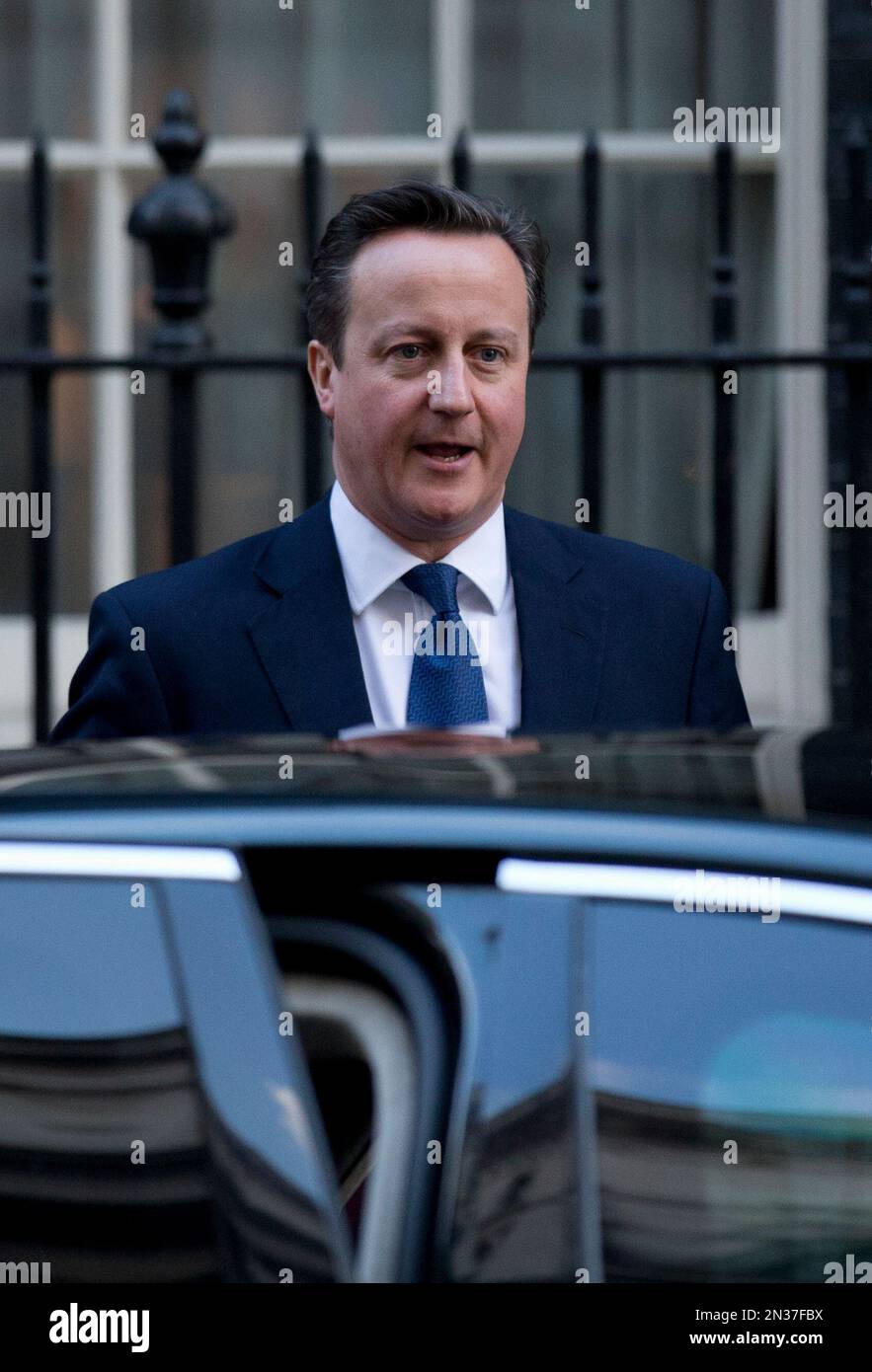 British Prime Minister David Cameron gets into a car as he leaves 10 ...