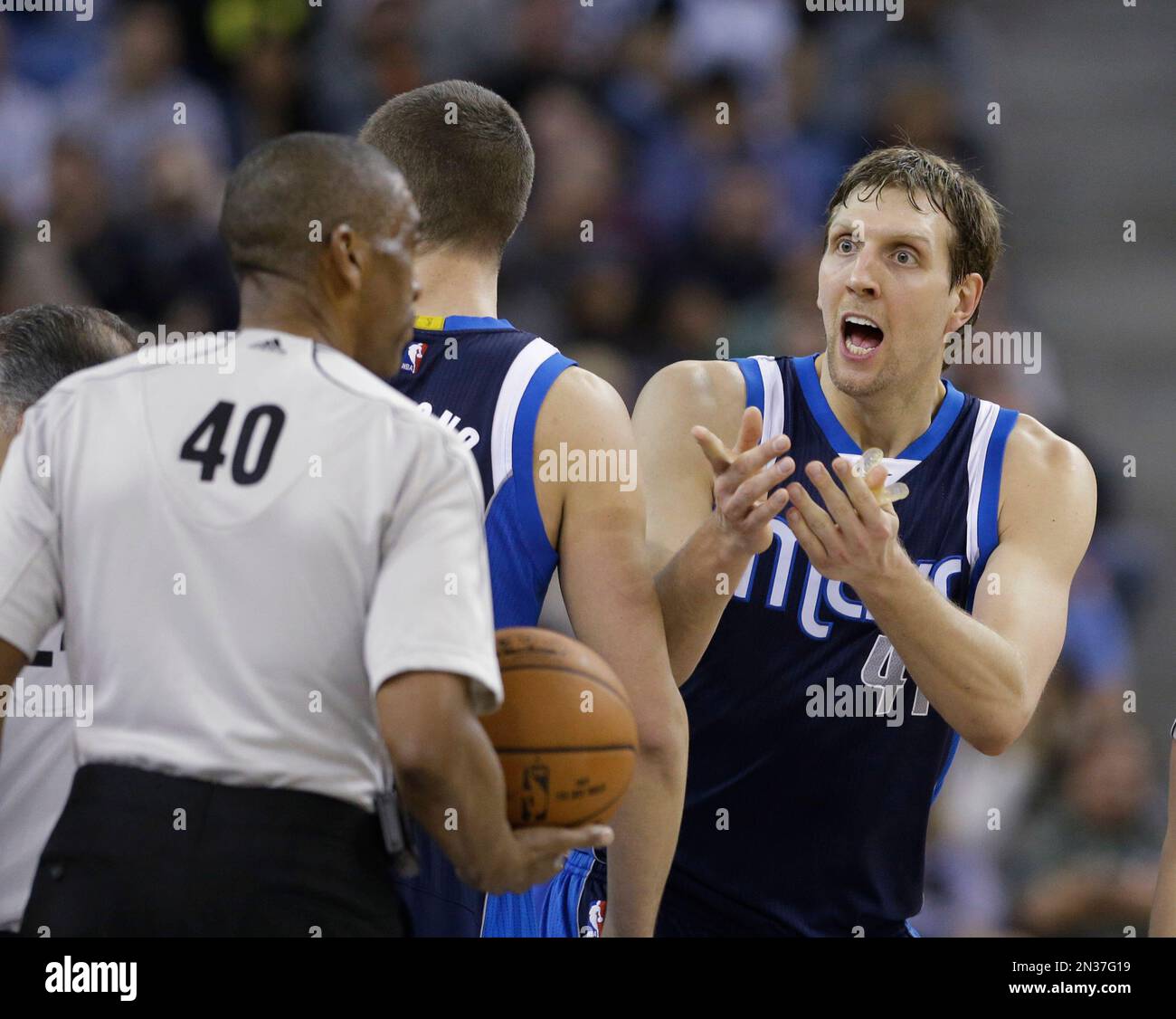 Dallas Mavericks forward Dirk Nowitzki, right, of Germany, questions ...