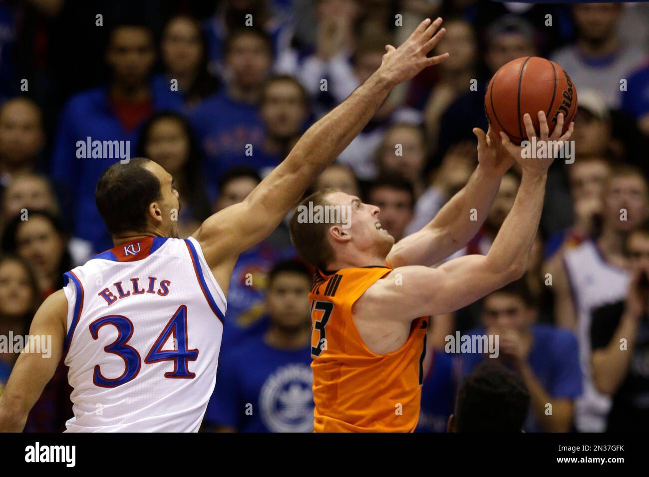 Oklahoma State guard Phil Forte III (13) and Kansas forward Perry Ellis ...