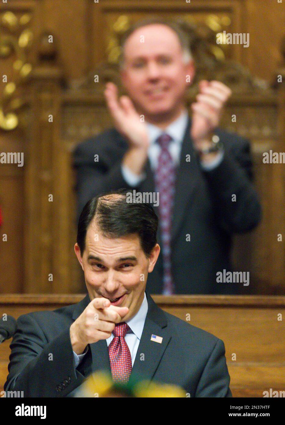Wisconsin Gov. Scott Walker acknowledges people in the chambers during ...
