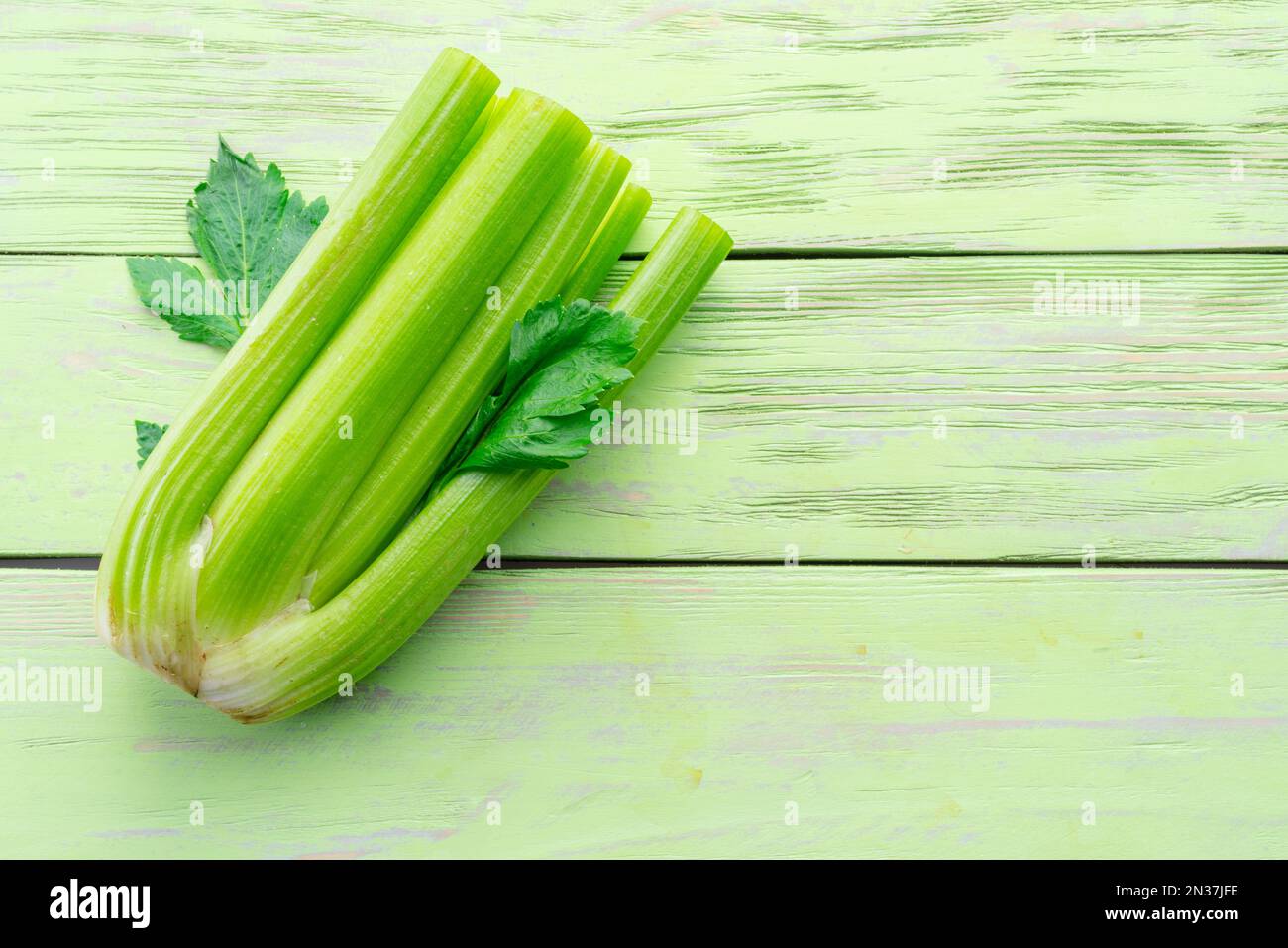 Pile of celery ribs isolated on white background Stock Photo - Alamy