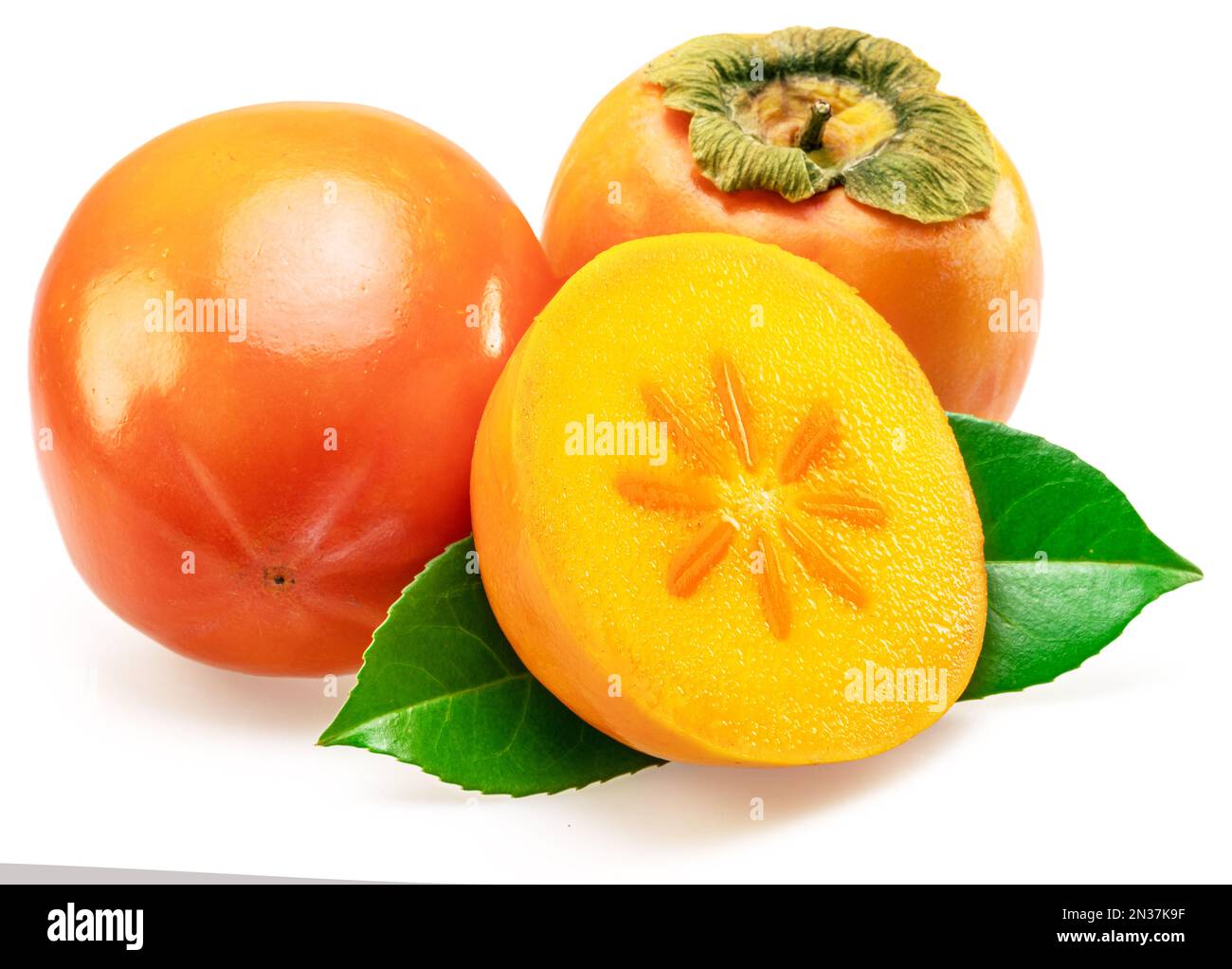 Ripe orange persimmon fruits or kaki fruits with leaves and cross cut ...
