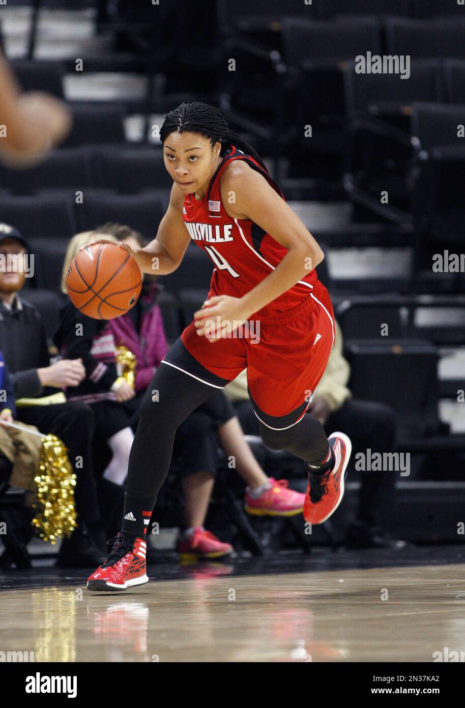Louisville forward Mariya Moore brings the ball upcourt as her team ...