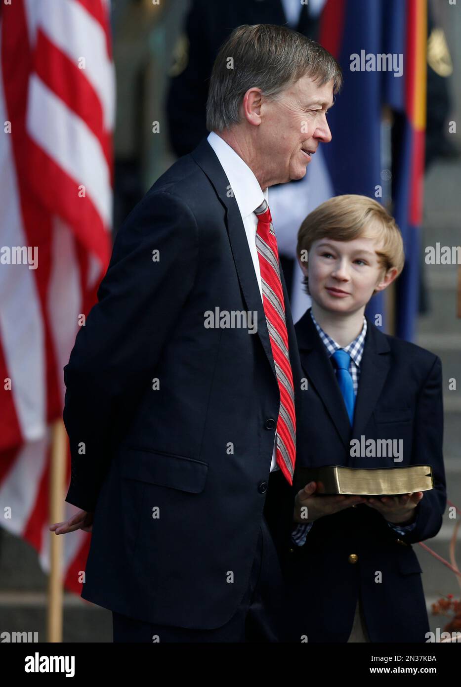 Colorado Gov. John Hickenlooper waits with his son, Teddy, before ...