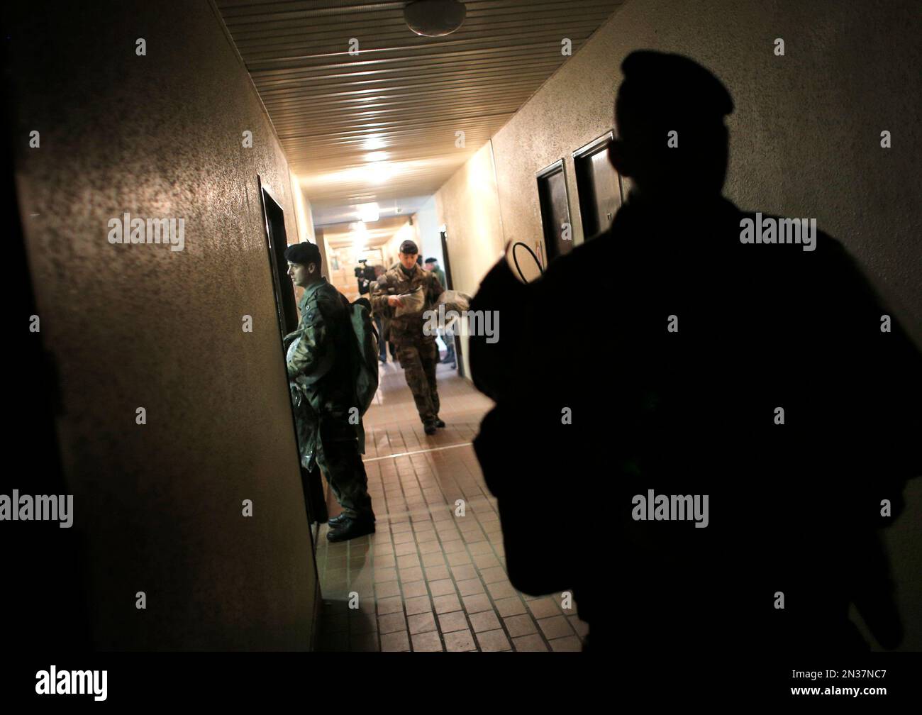 French soldiers prepare before patrolling, at the Satory military camp ...