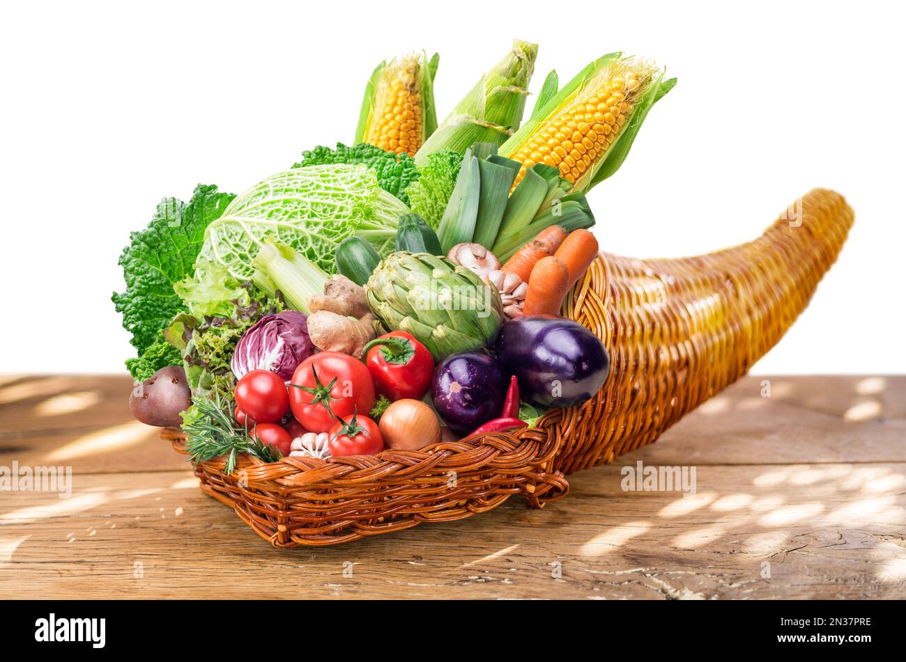 Horn of plenty with fresh organic vegetables and herbs as a symbol of ...