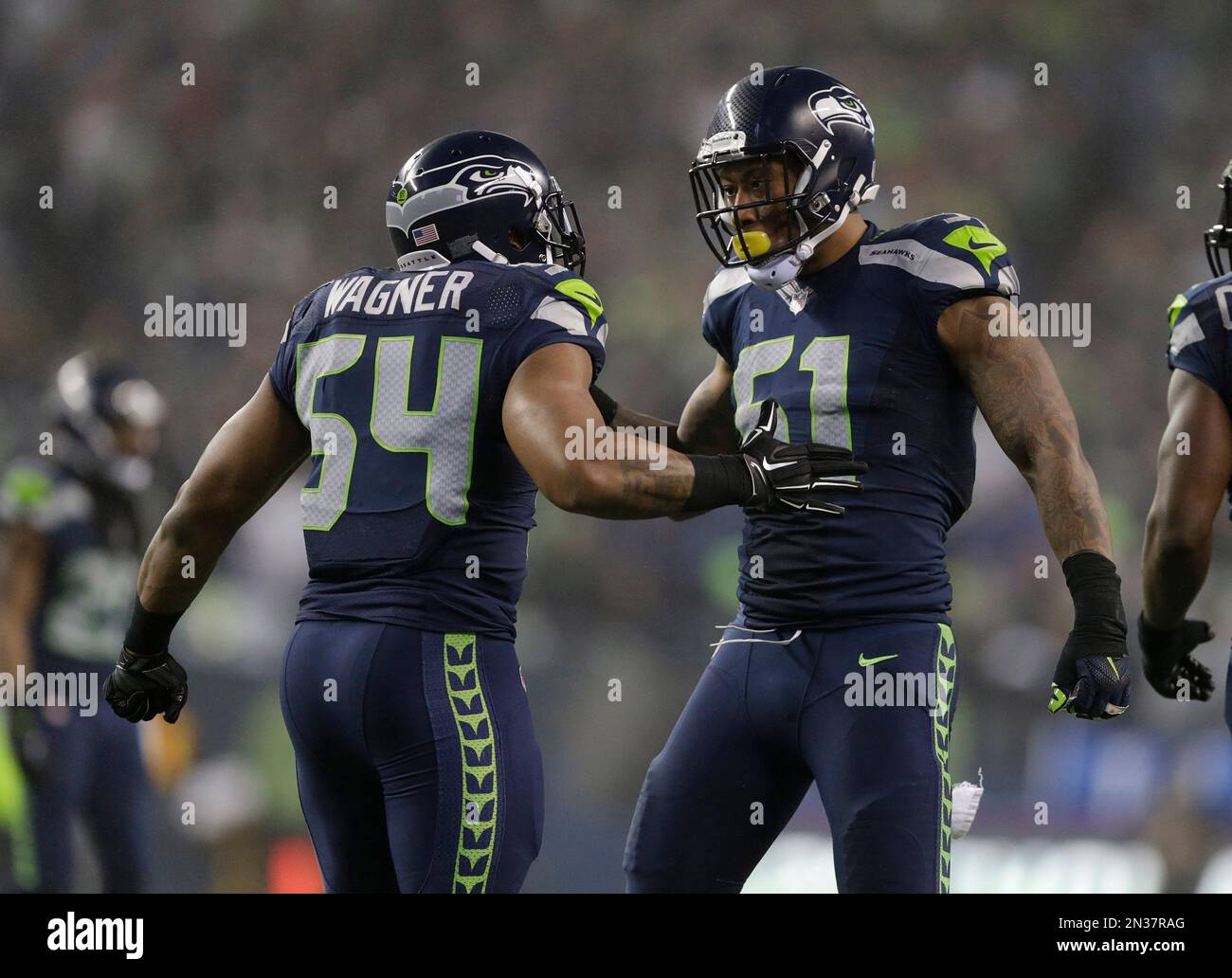 Seattle Seahawks middle linebacker Bobby Wagner (54) and defensive end ...