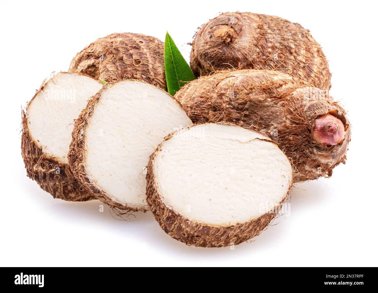 Eddoe or taro tubers and its slices isolated on white background Stock ...