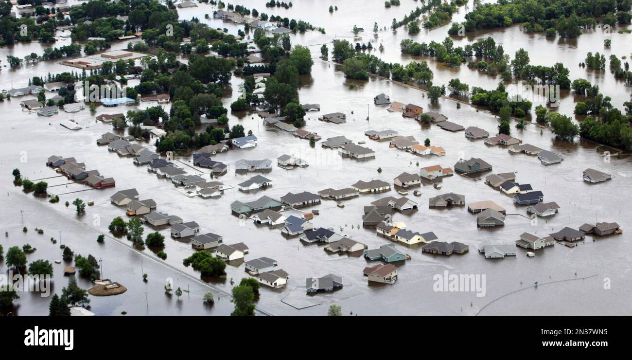 FILE - This July 27, 2011 file photo shows homes flooded by the Souris ...