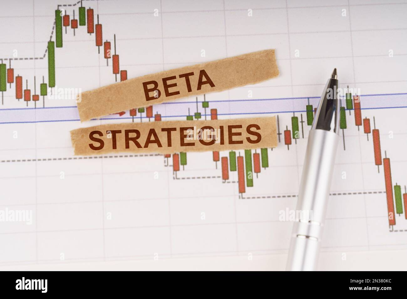 Business concept. On the chart of business quotes lies a pen and torn ...