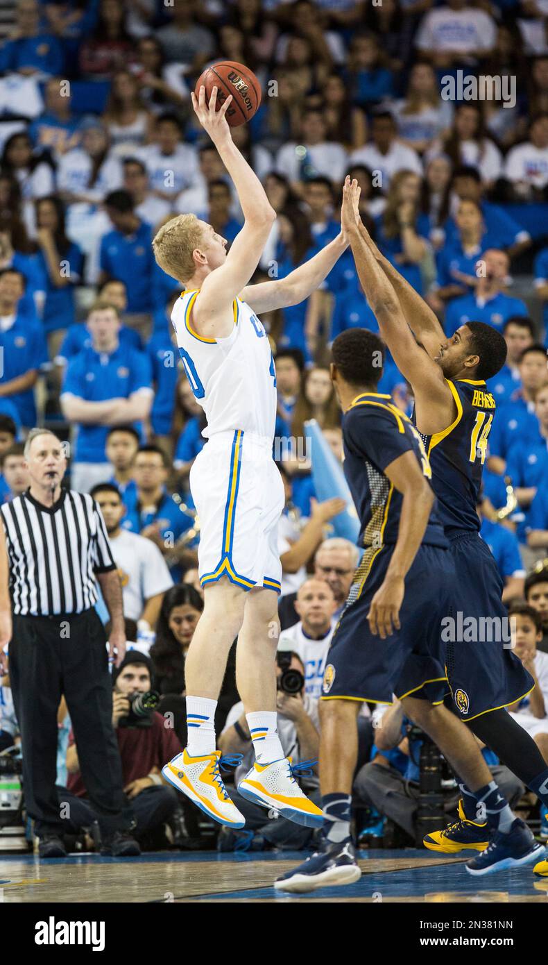UCLA center Thomas Welsh #40, left, goes up against California in their ...