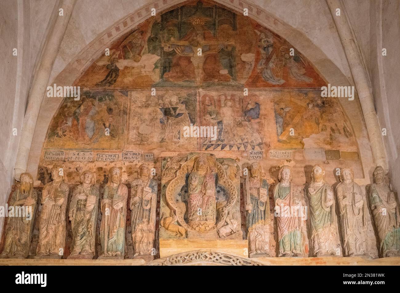 Details of the painted medieval portal of the clocher-porche (tower) of ...