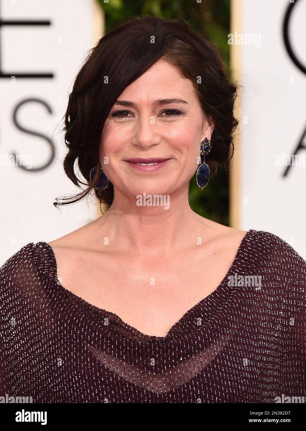 Maura Tierney arrives at the 72nd annual Golden Globe Awards at the ...