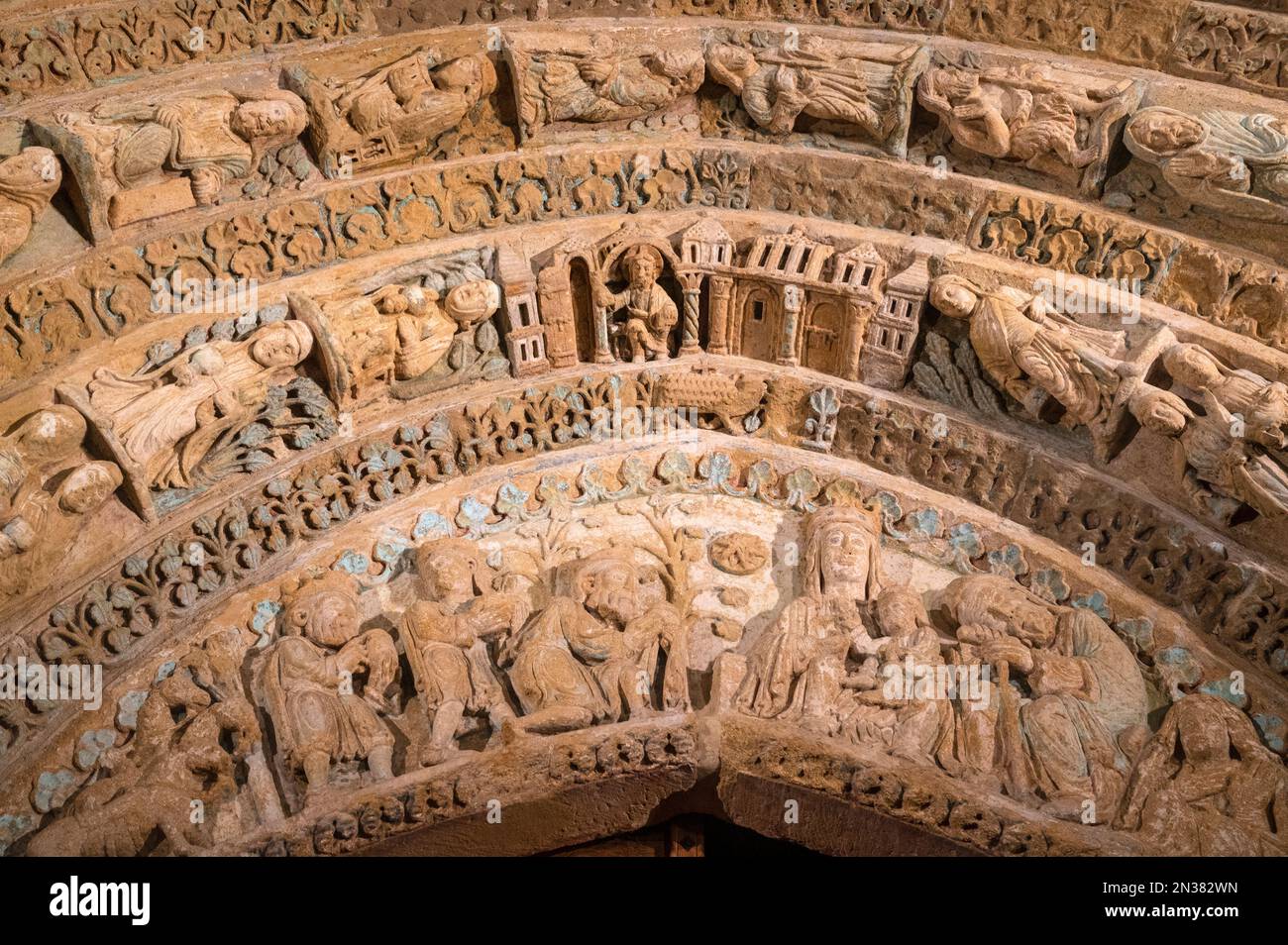 Details of the painted medieval portal of the clocher-porche (tower) of ...