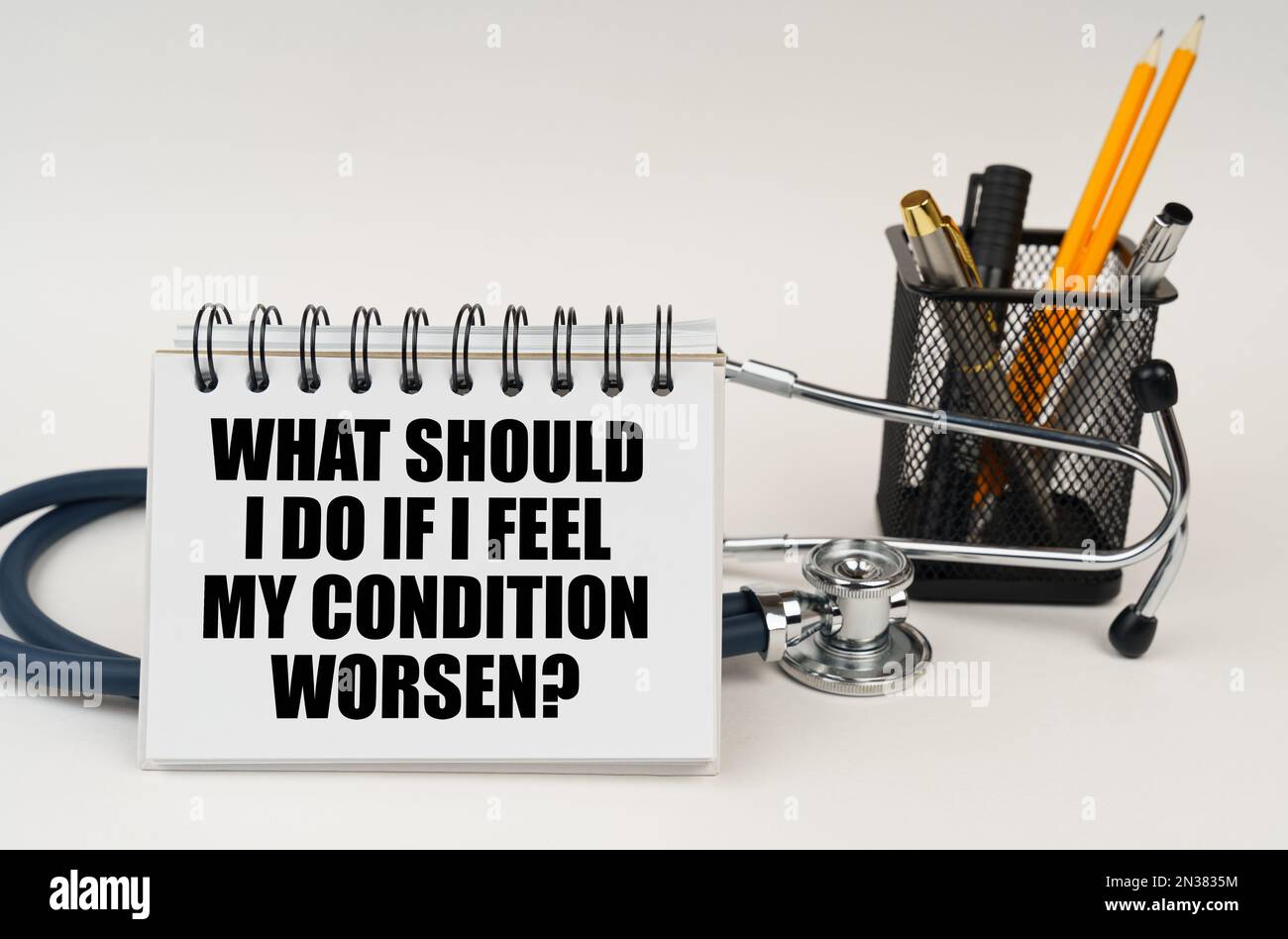 Medical concept. On the table are office supplies, a stethoscope and a ...