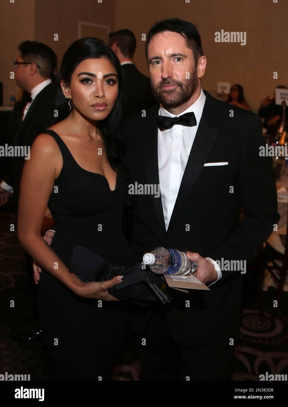 Mariqueen Maandig, left, and Trent Reznor pose in the audience at the ...