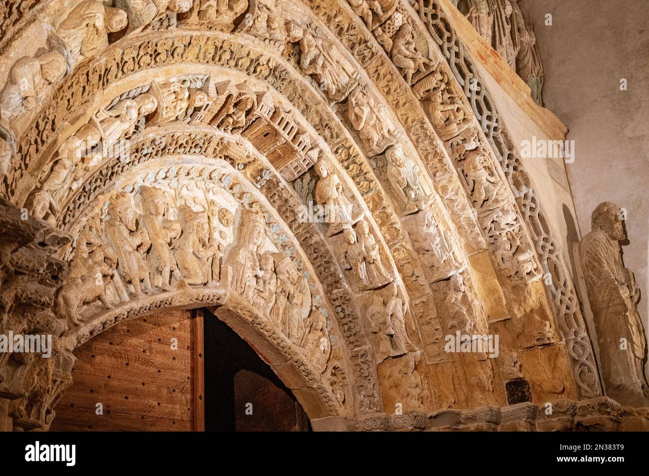 Details of the painted medieval portal of the clocher-porche (tower) of ...