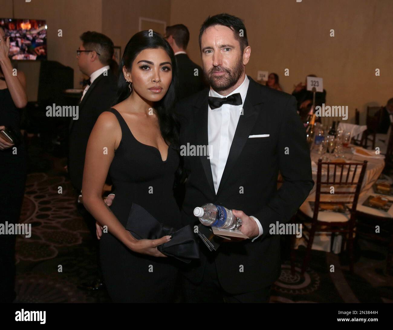 Mariqueen Maandig, left, and Trent Reznor pose in the audience at the ...