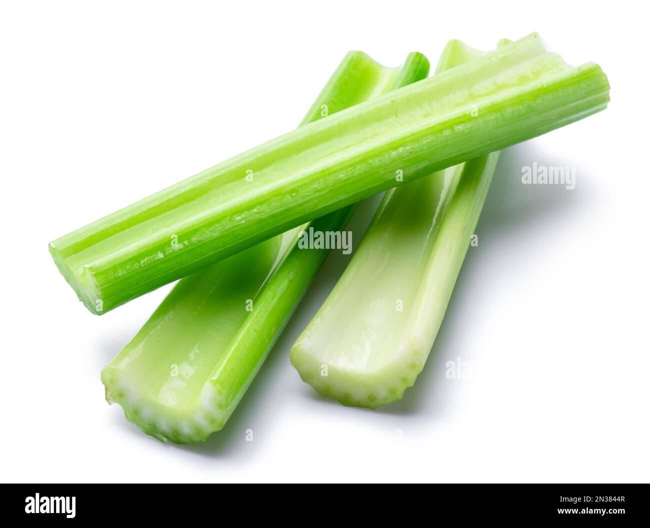Pile of celery ribs isolated on white background Stock Photo - Alamy