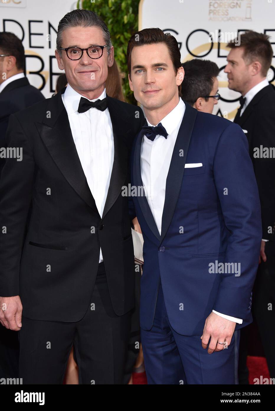 Simon Halls, left, and Matt Bomer arrive at the 72nd annual Golden Globe Awards at the Beverly ...