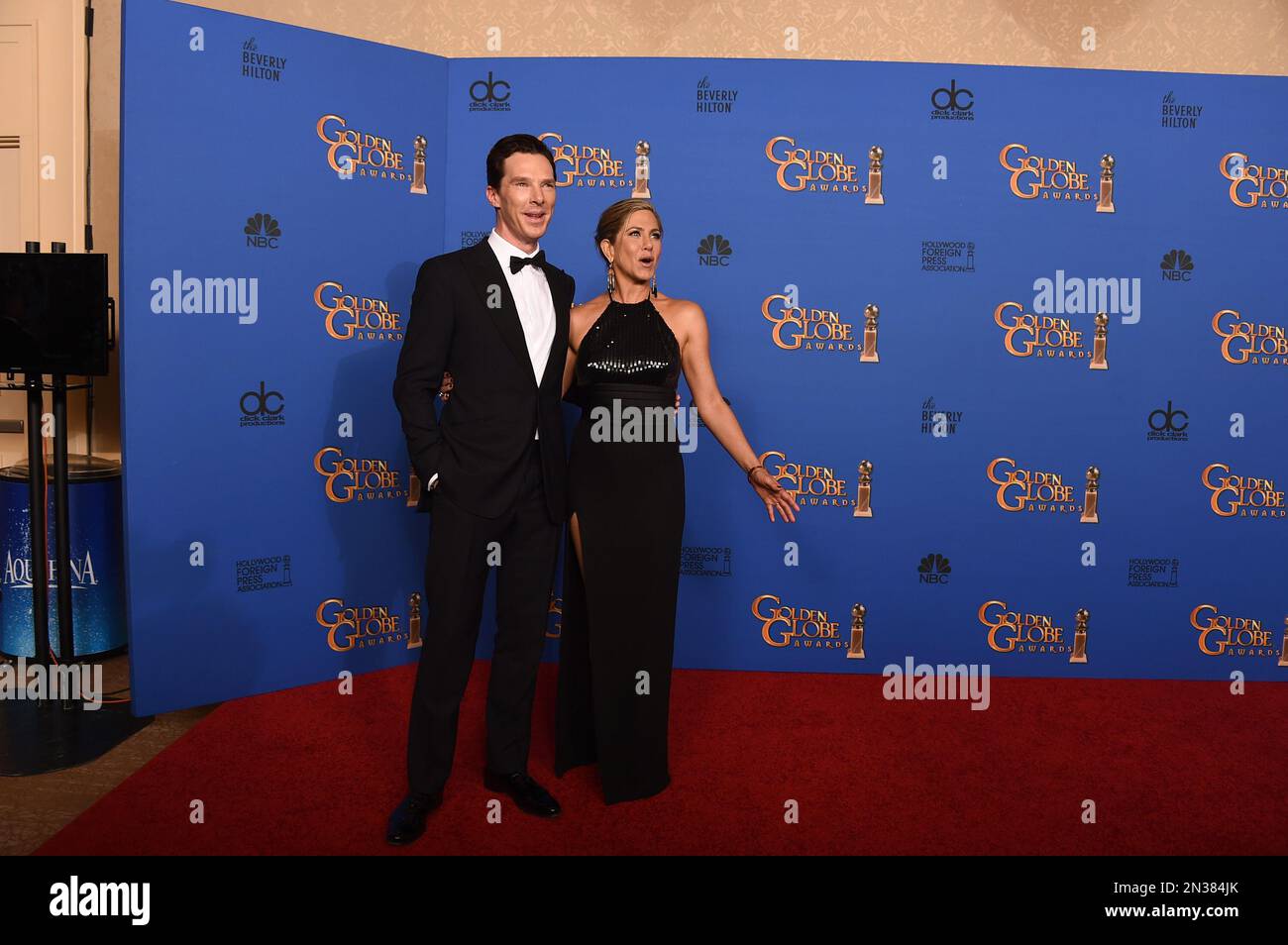 Benedict Cumberbatch, left, and Jennifer Aniston pose in the press room ...