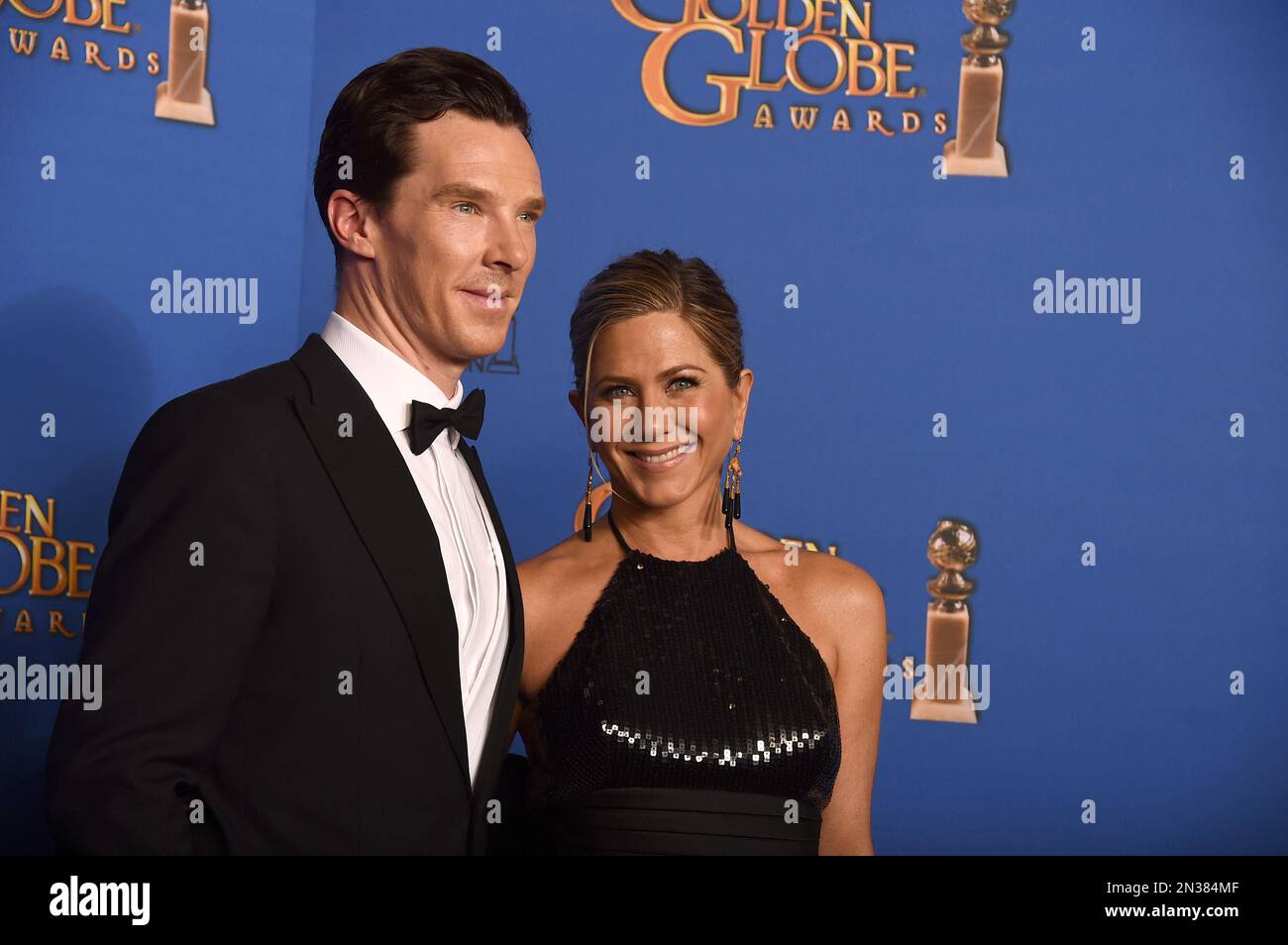Benedict Cumberbatch, left, and Jennifer Aniston pose in the press room ...