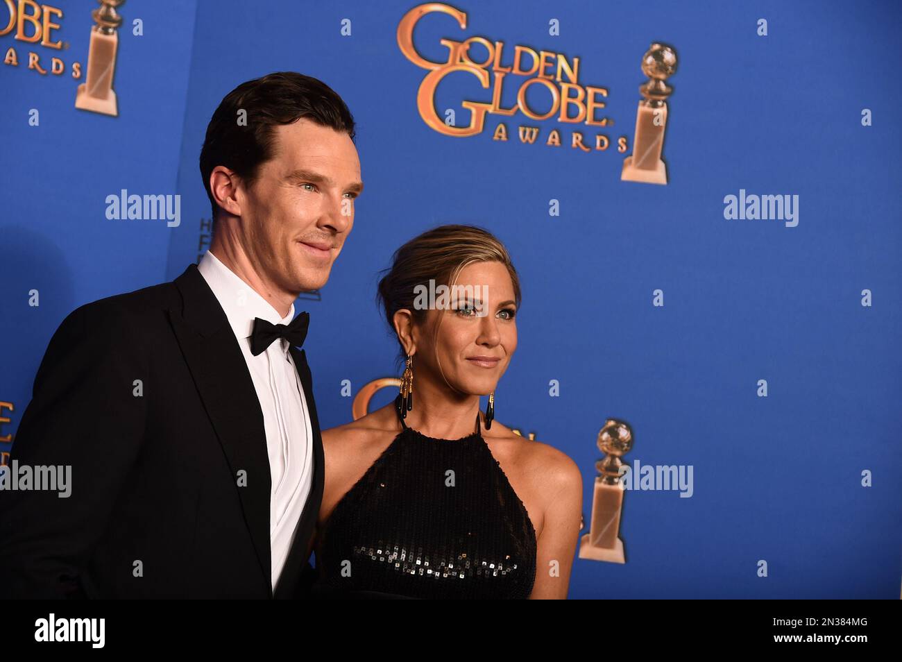Benedict Cumberbatch, left, and Jennifer Aniston pose in the press room ...