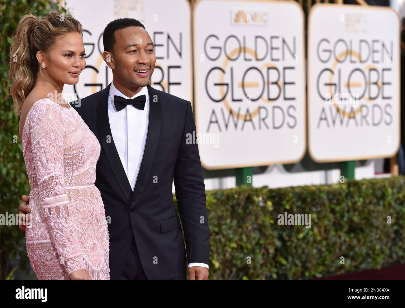 Chrissy Teigen, left, and John Legend arrive at the 72nd annual Golden ...