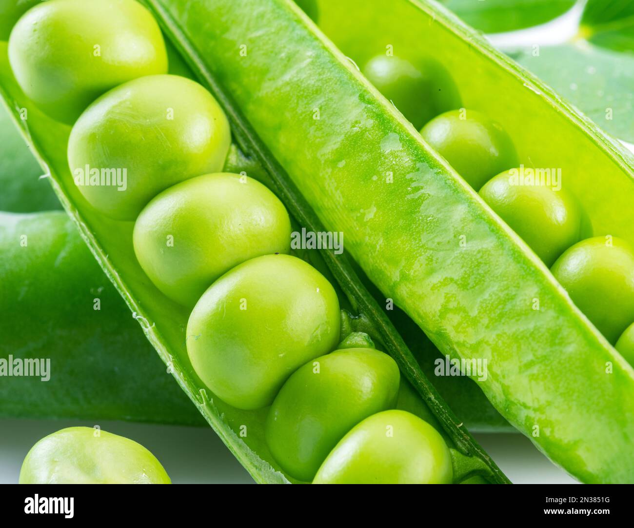 Perfect green peas in pea pods close up. Food background Stock Photo ...