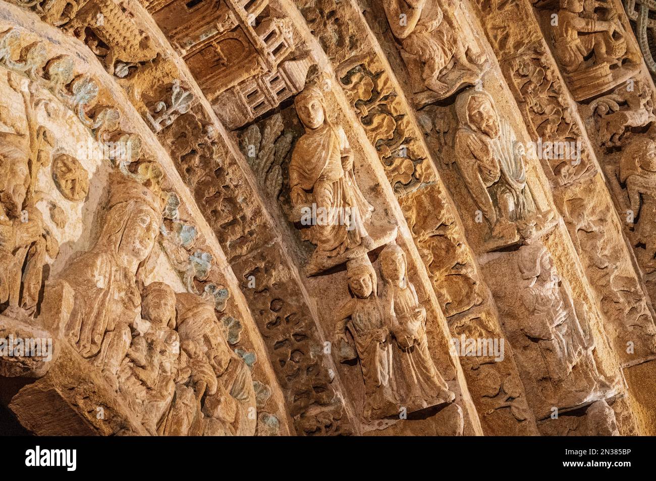 Details of the painted medieval portal of the clocher-porche (tower) of ...