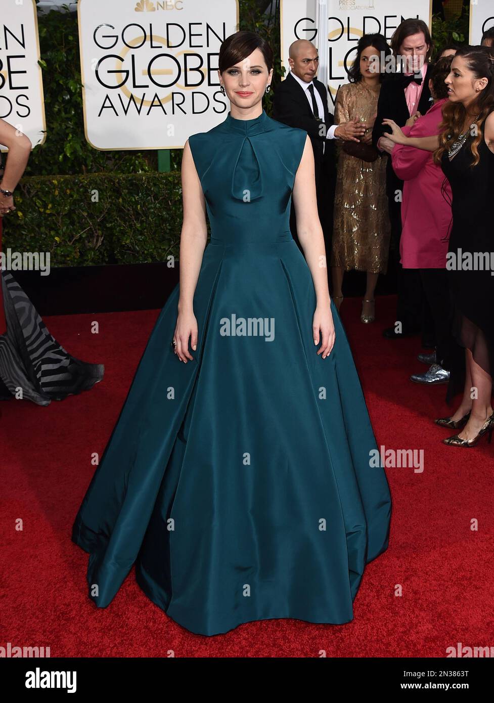 Felicity Jones arrives at the 72nd annual Golden Globe Awards at the ...
