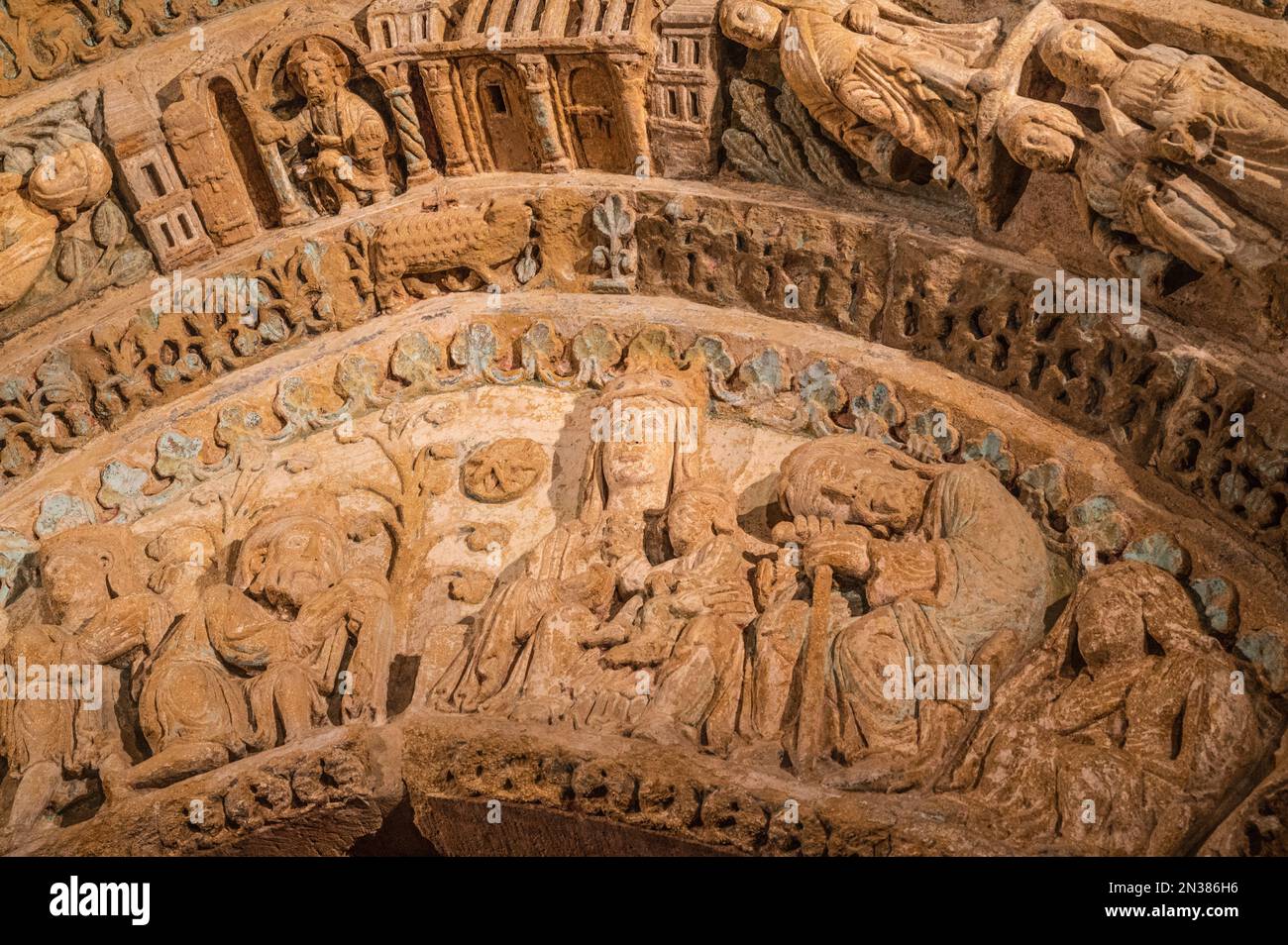 Details of the painted medieval portal of the clocher-porche (tower) of ...