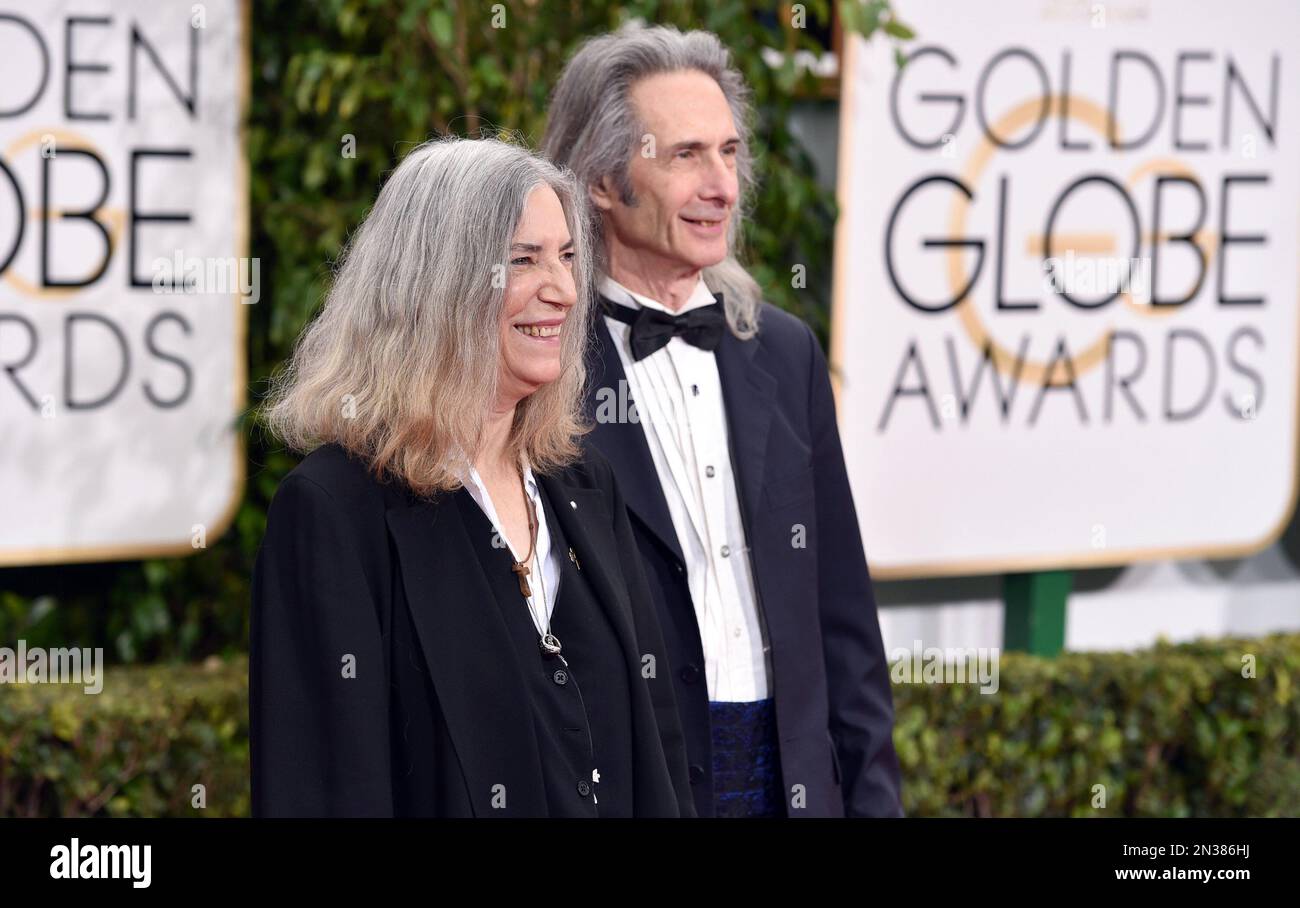 Patti Smith, left, and Lenny Kaye arrive at the 72nd annual Golden ...