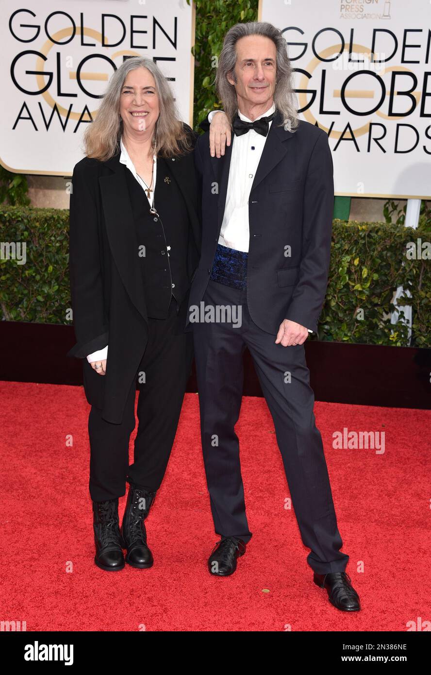 Patti Smith, left, and Lenny Kaye arrive at the 72nd annual Golden ...