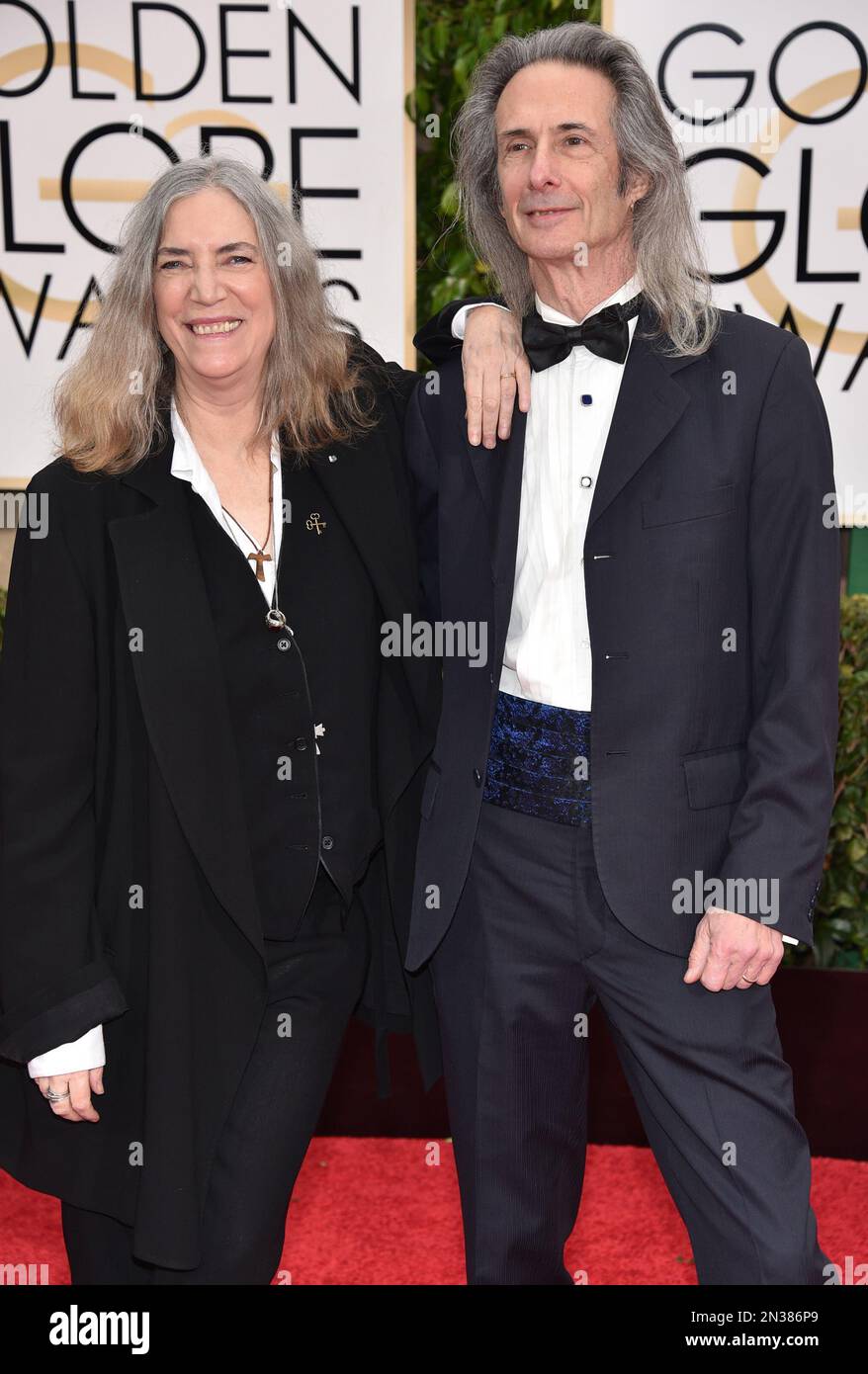 Patti Smith, left, and Lenny Kaye arrive at the 72nd annual Golden ...
