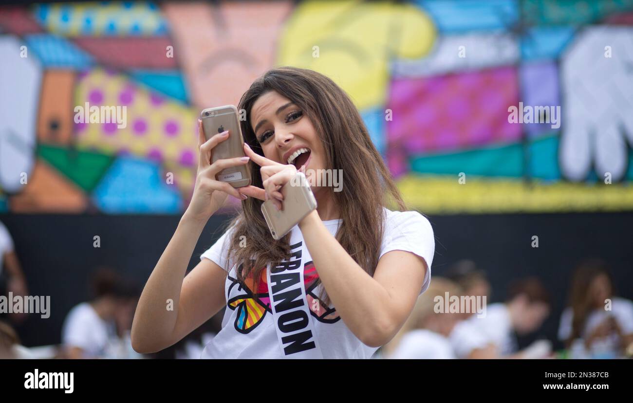 Miss Lebanon, Saly Greige, poses for photos after she painted on a wall ...