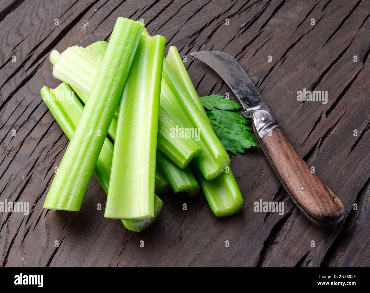 Pile of celery ribs isolated on white background Stock Photo - Alamy