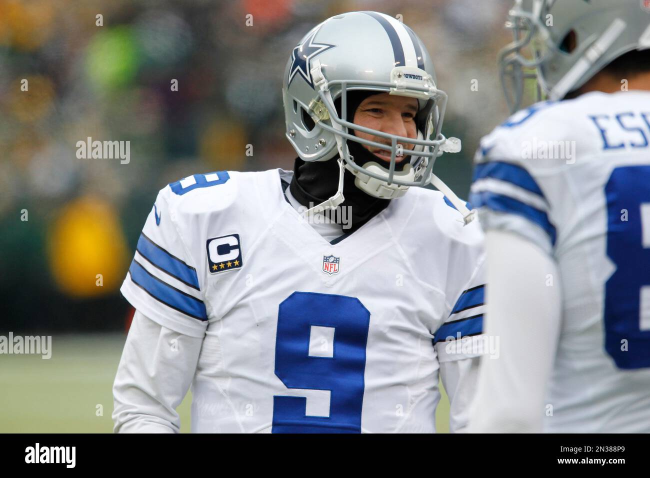 Dallas Cowboys quarterback Tony Romo (9) speaks to a player during the ...