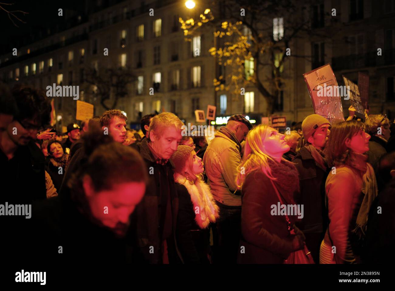 The crowd march in Paris, France, Sunday, Jan. 11, 2015. Hundreds of ...