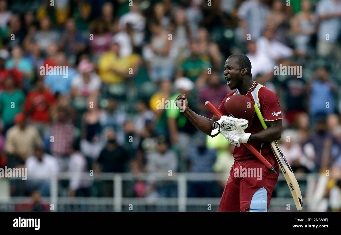 West Indies captain Darren Sammy celebrates scoring winning runs during ...