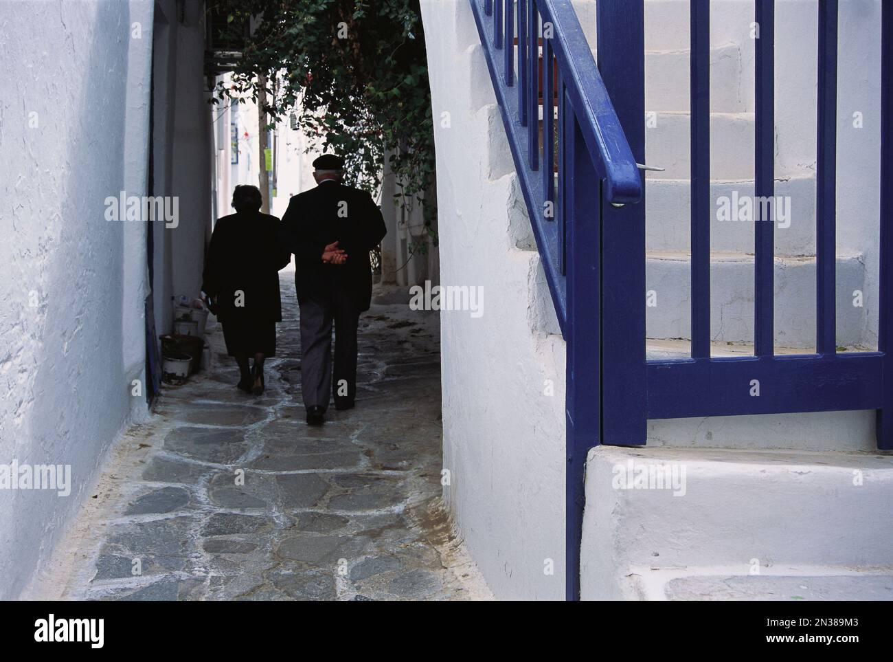 Back View of Mature Couple Walking on Path, Mykonos, Greece Stock Photo ...