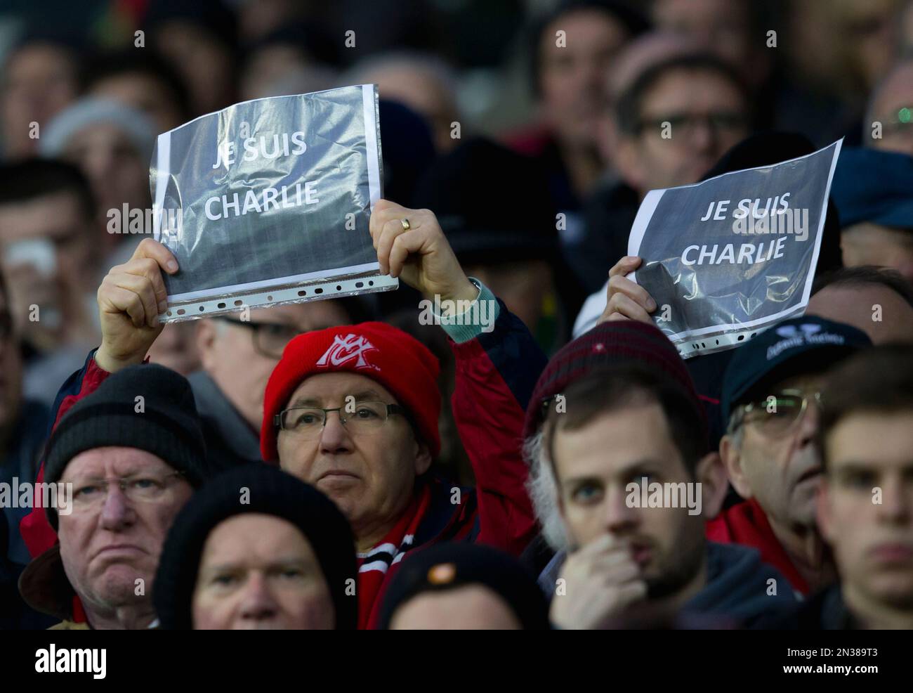 Je Suis Charlie signs are held up before the English Premier League ...
