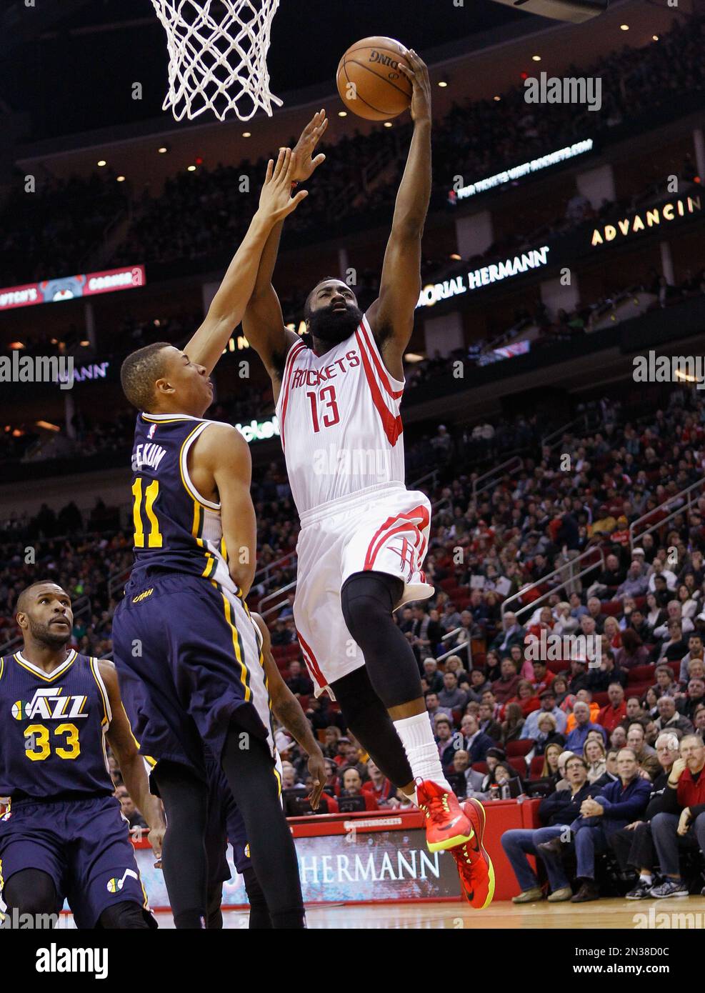 Houston Rockets guard James Harden (13) drives to the basket on Utah ...