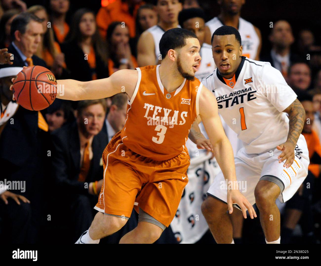 Texas guard Javan Felix (3) drives past Oklahoma State guard Tyree ...