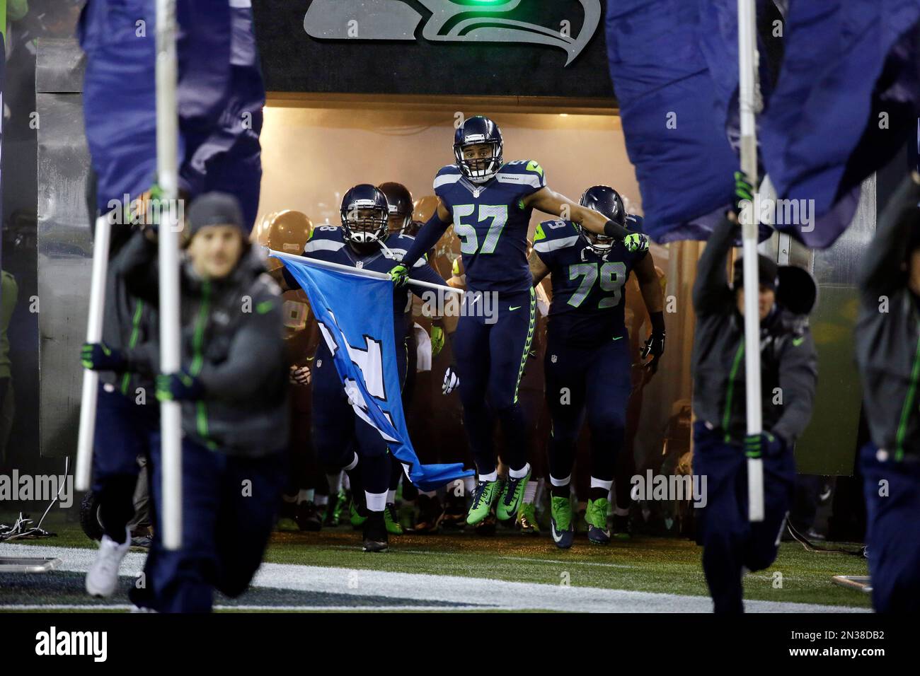 Seattle Seahawks linebacker Mike Morgan (57) leads teammates out of the ...