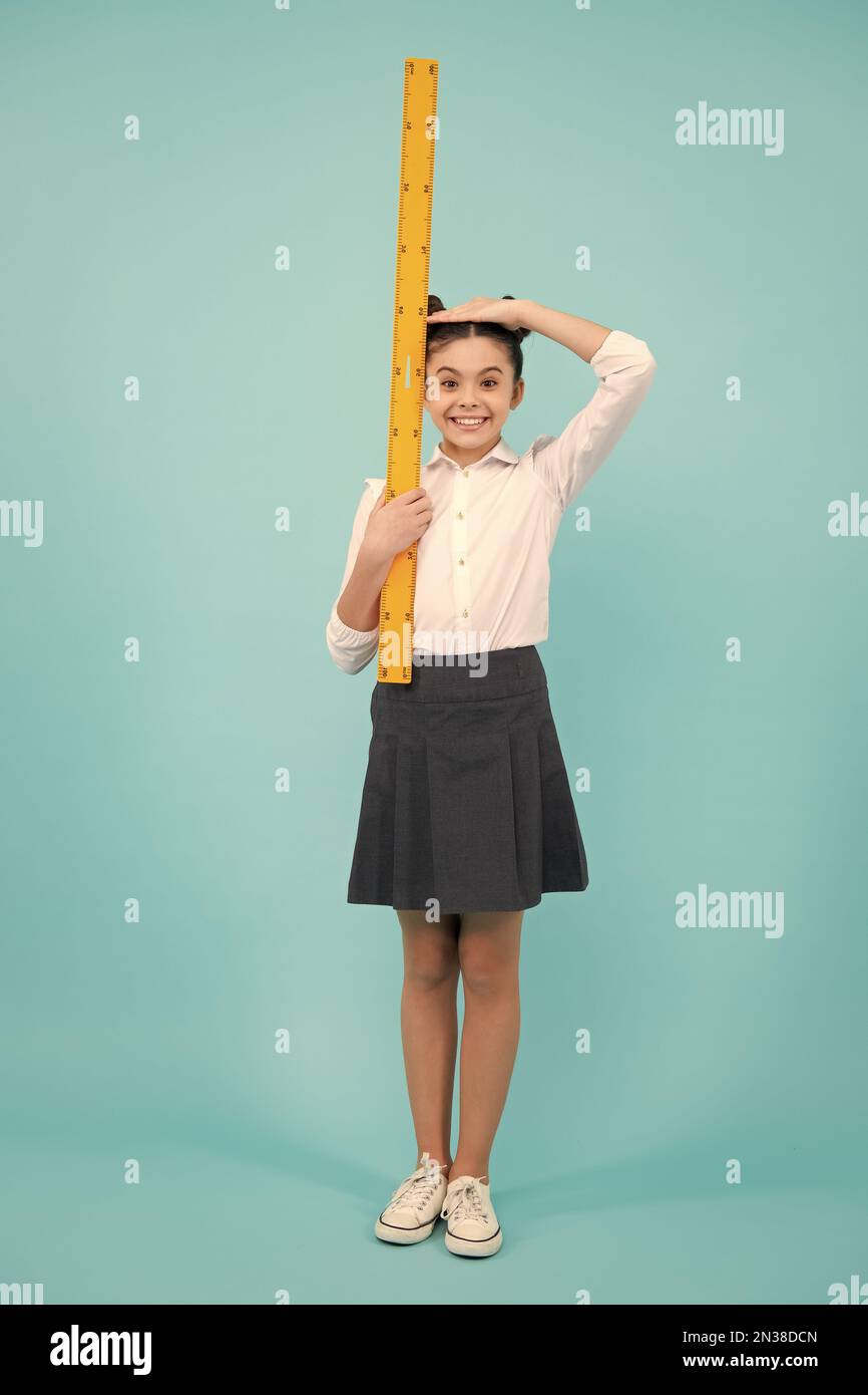 Kid height measure, growth measurement. Teenager school girl study math ...