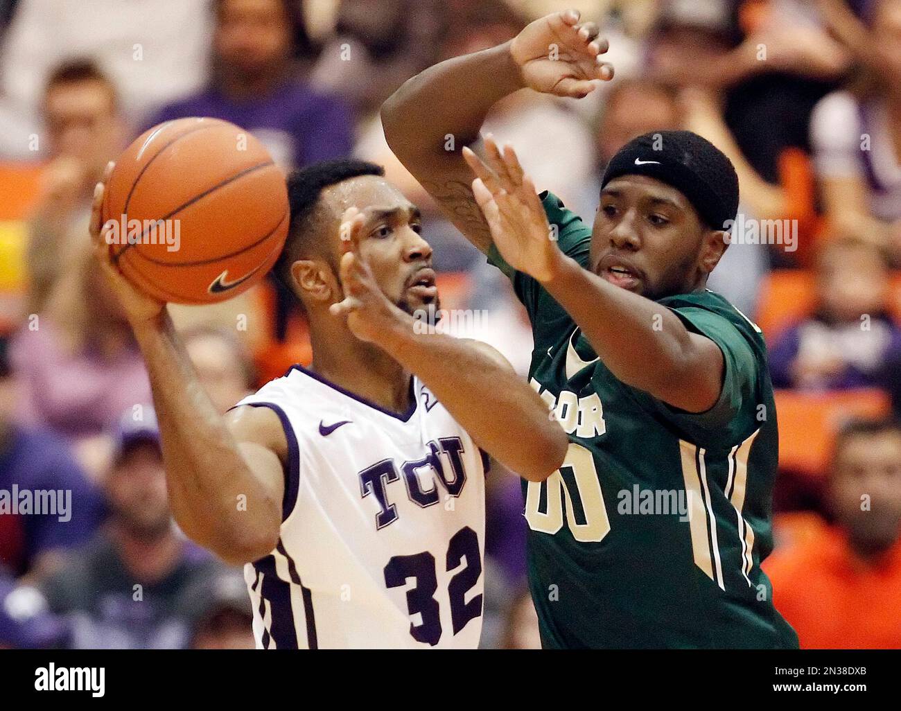 TCU guard Trey Zeigler (32) looks to pass as Baylor forward Royce O ...