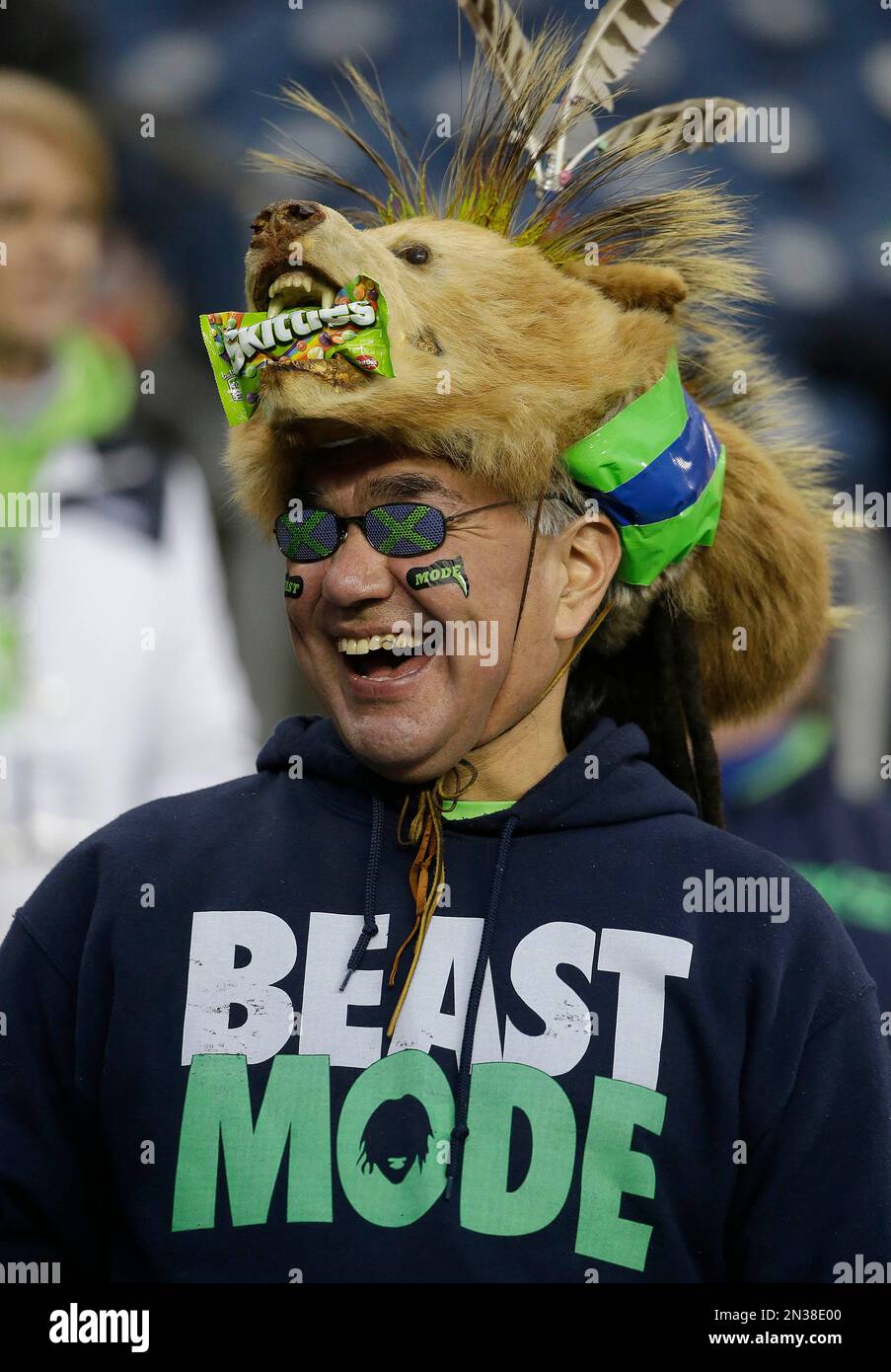 A Seattle Seahawks fan smiles before an NFL divisional playoff football ...