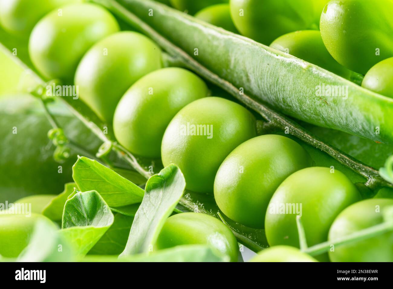 Perfect green peas in pea pods close up. Food background Stock Photo ...