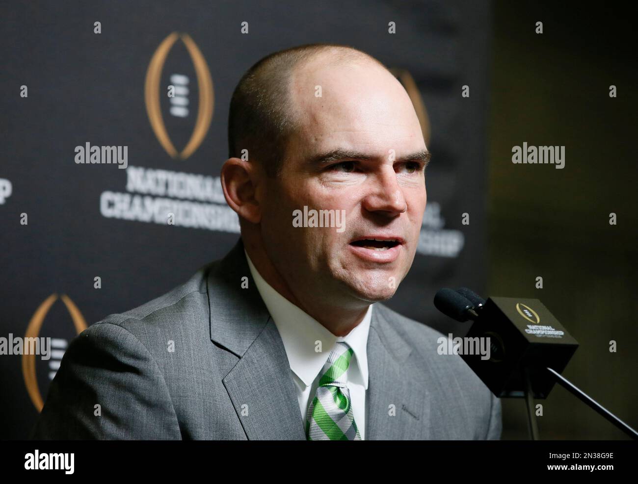 Oregon head coach Mark Helfrich responds to a question during media day ...